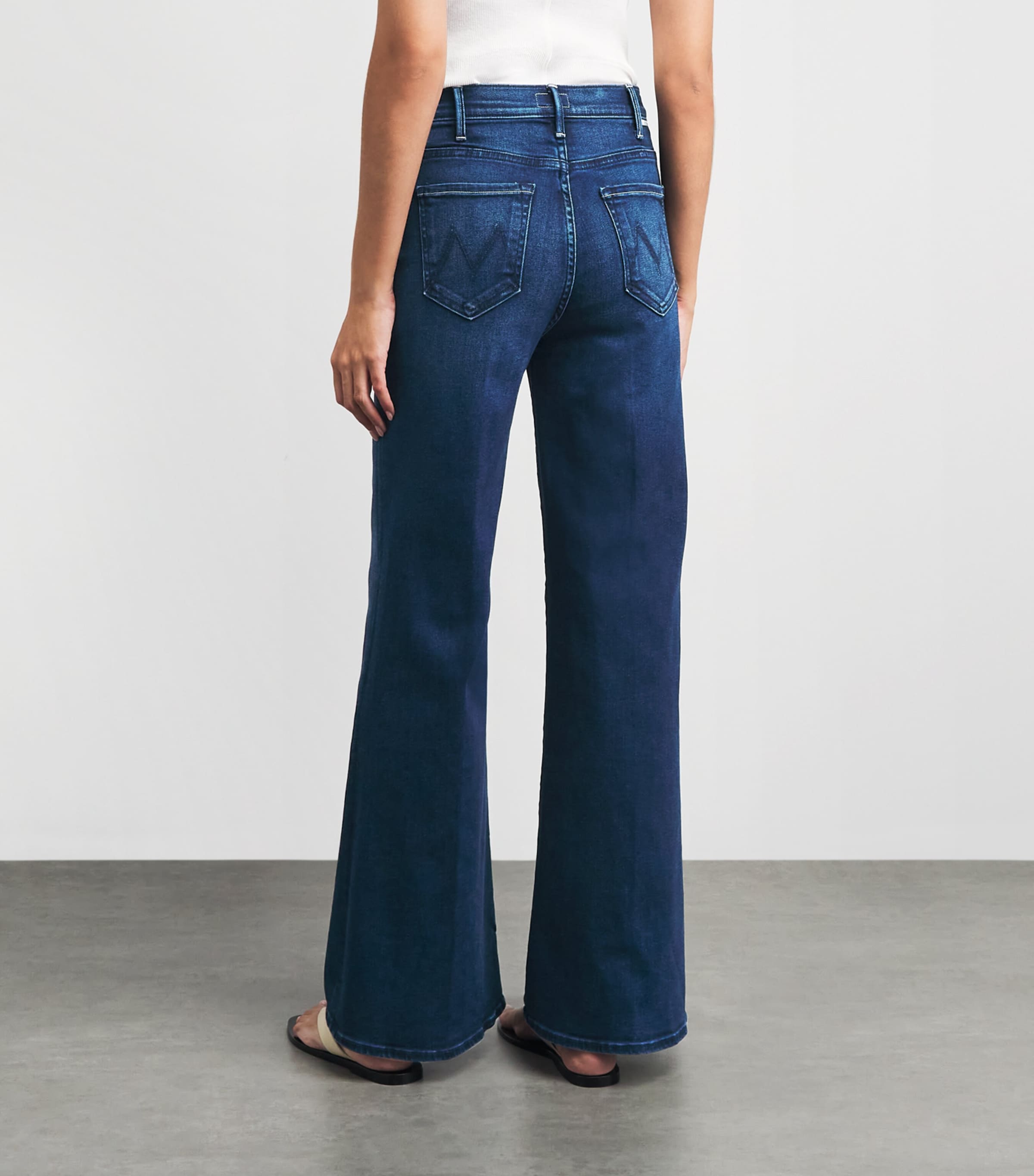 MOTHER Navy The Hustler Roller Sneak Jeans | Harrods SG