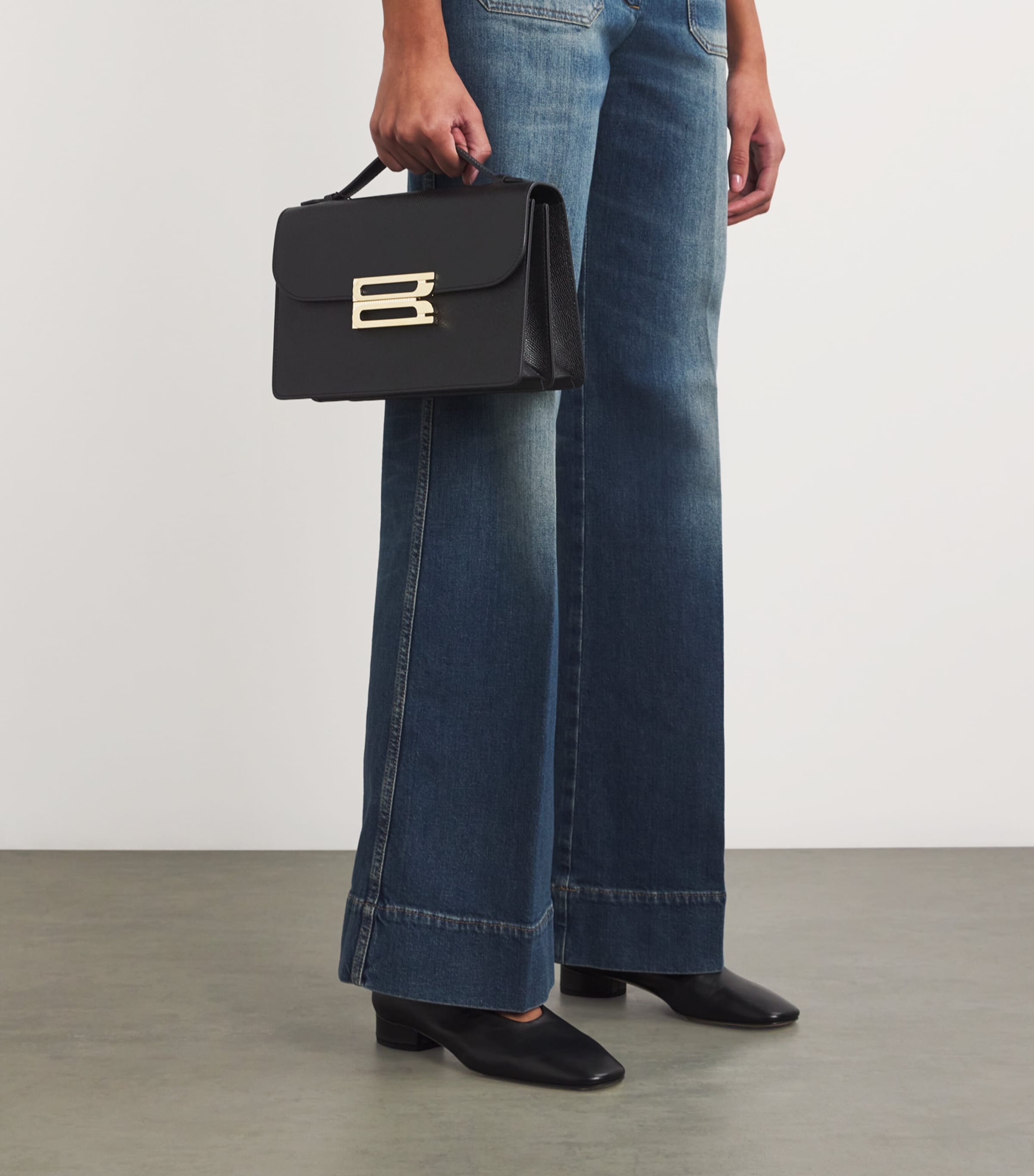 Victoria Beckham Black Leather B-Buckle Dorian Top-Handle Bag | Harrods US