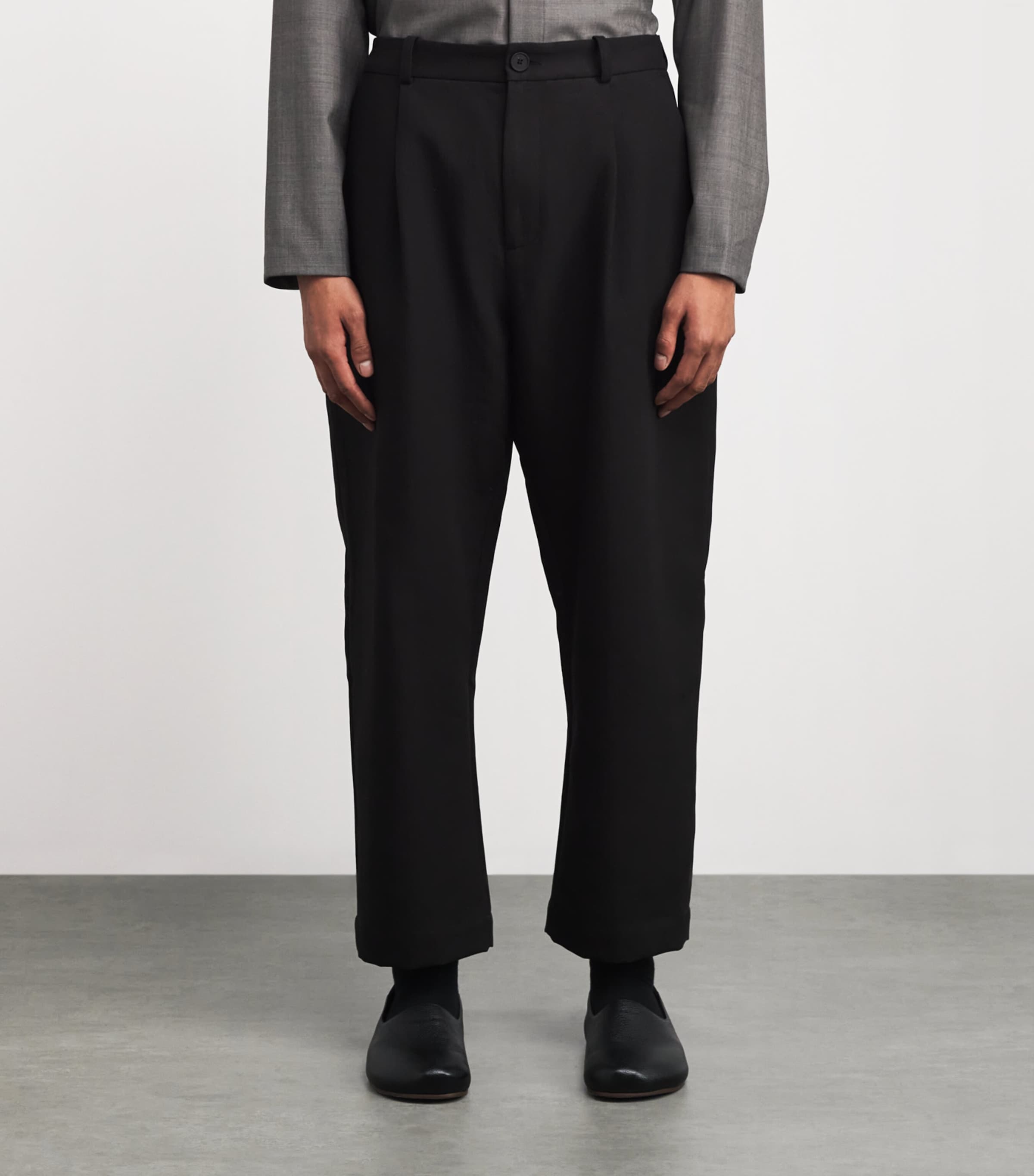 Studio Nicholson Black Cotton Pleated Trousers | Harrods AU