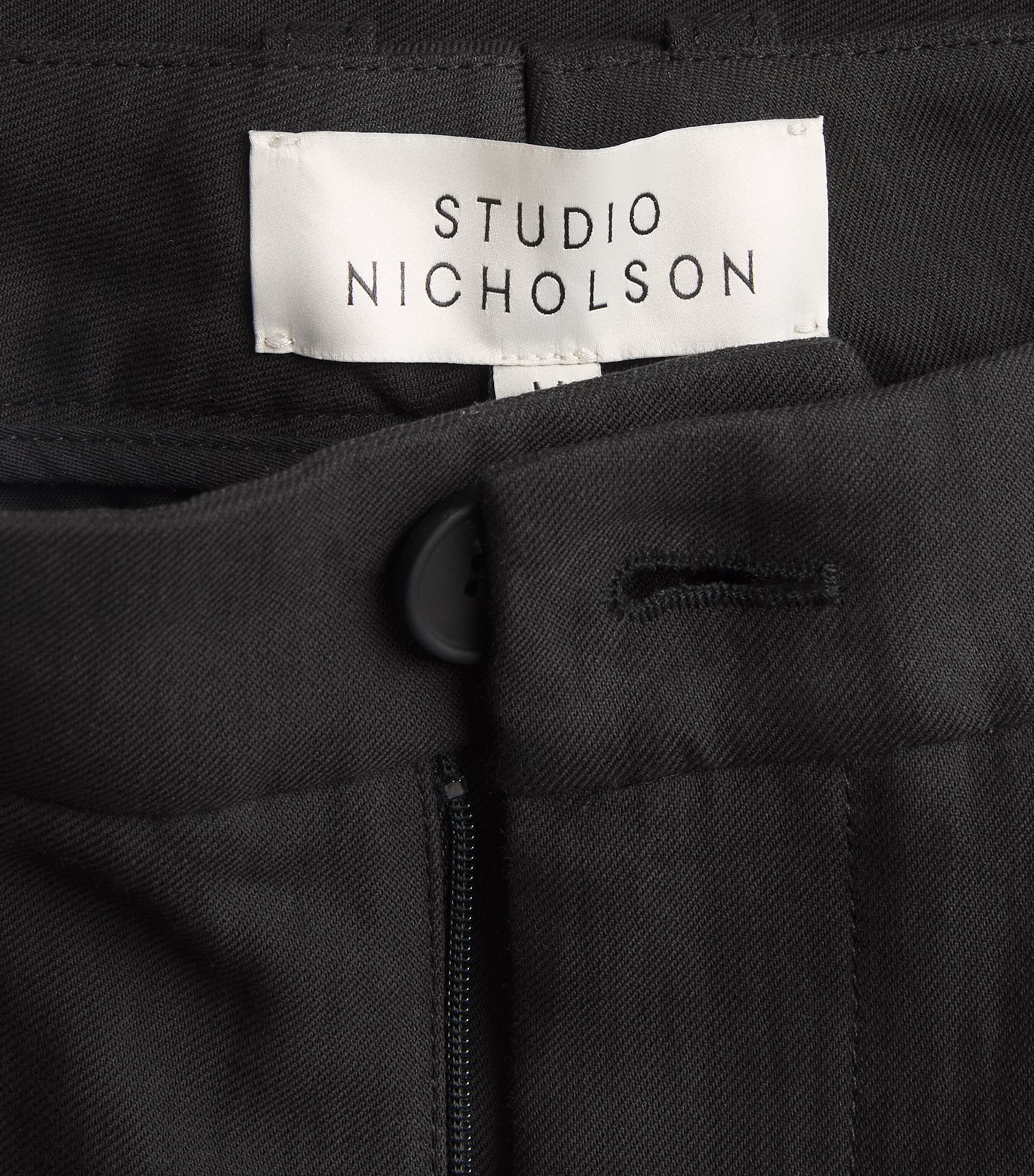 Studio Nicholson Black Cotton Pleated Trousers | Harrods AU