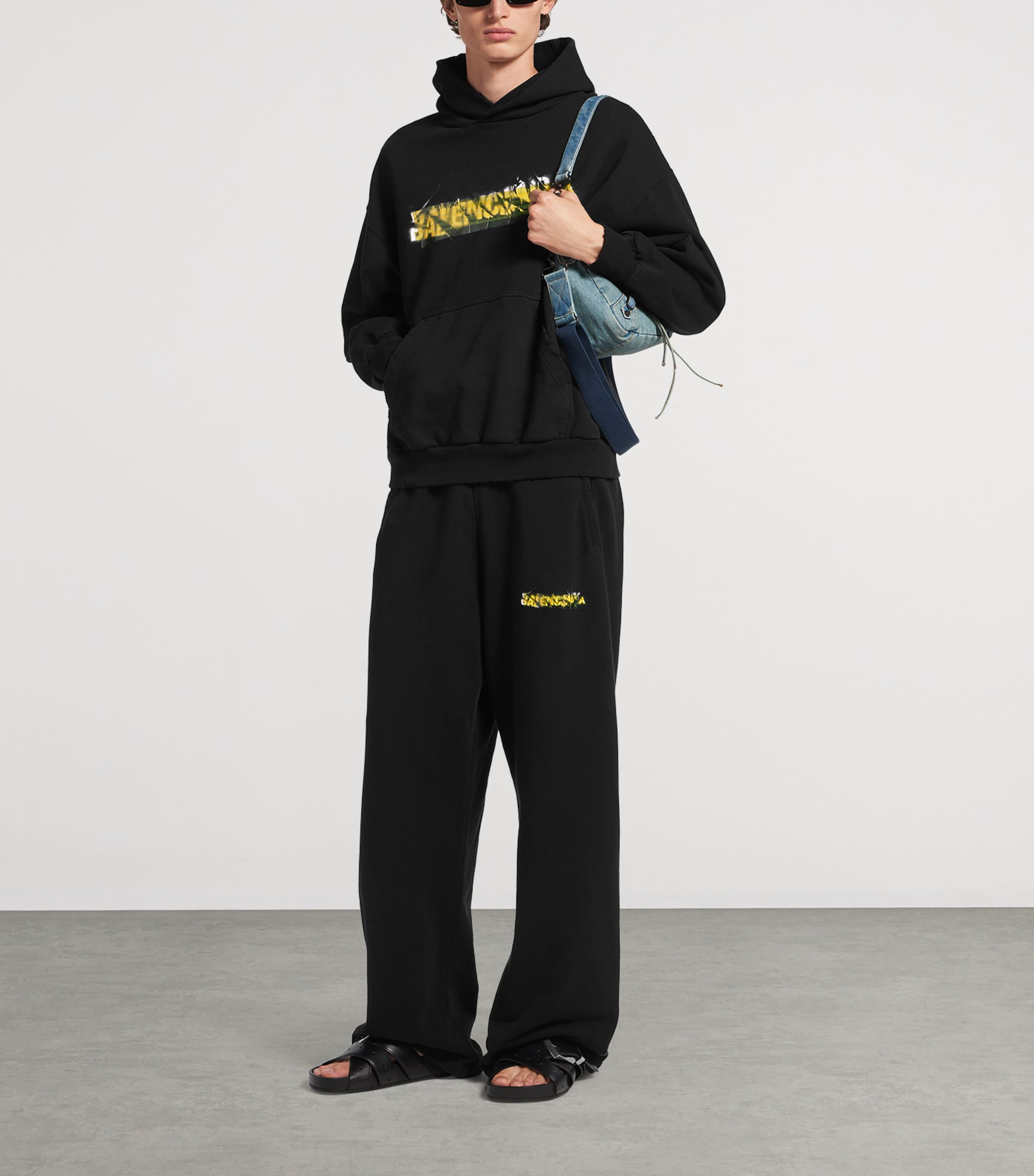 Balenciaga Black Cotton Messy Spray Logo Sweatpants | Harrods CA