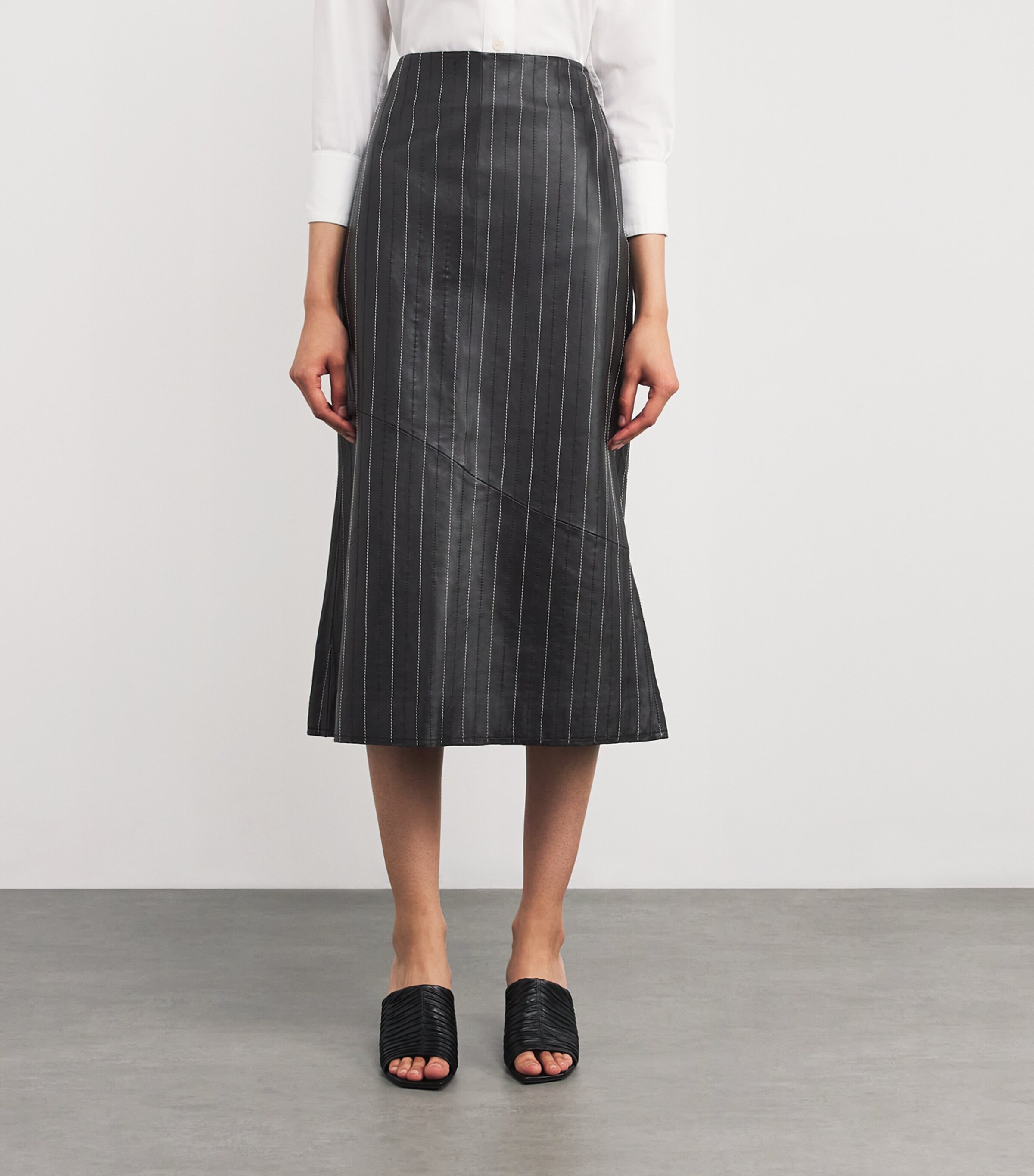 Victoria Beckham Black Leather Pinstripe Midi Skirt | Harrods UK