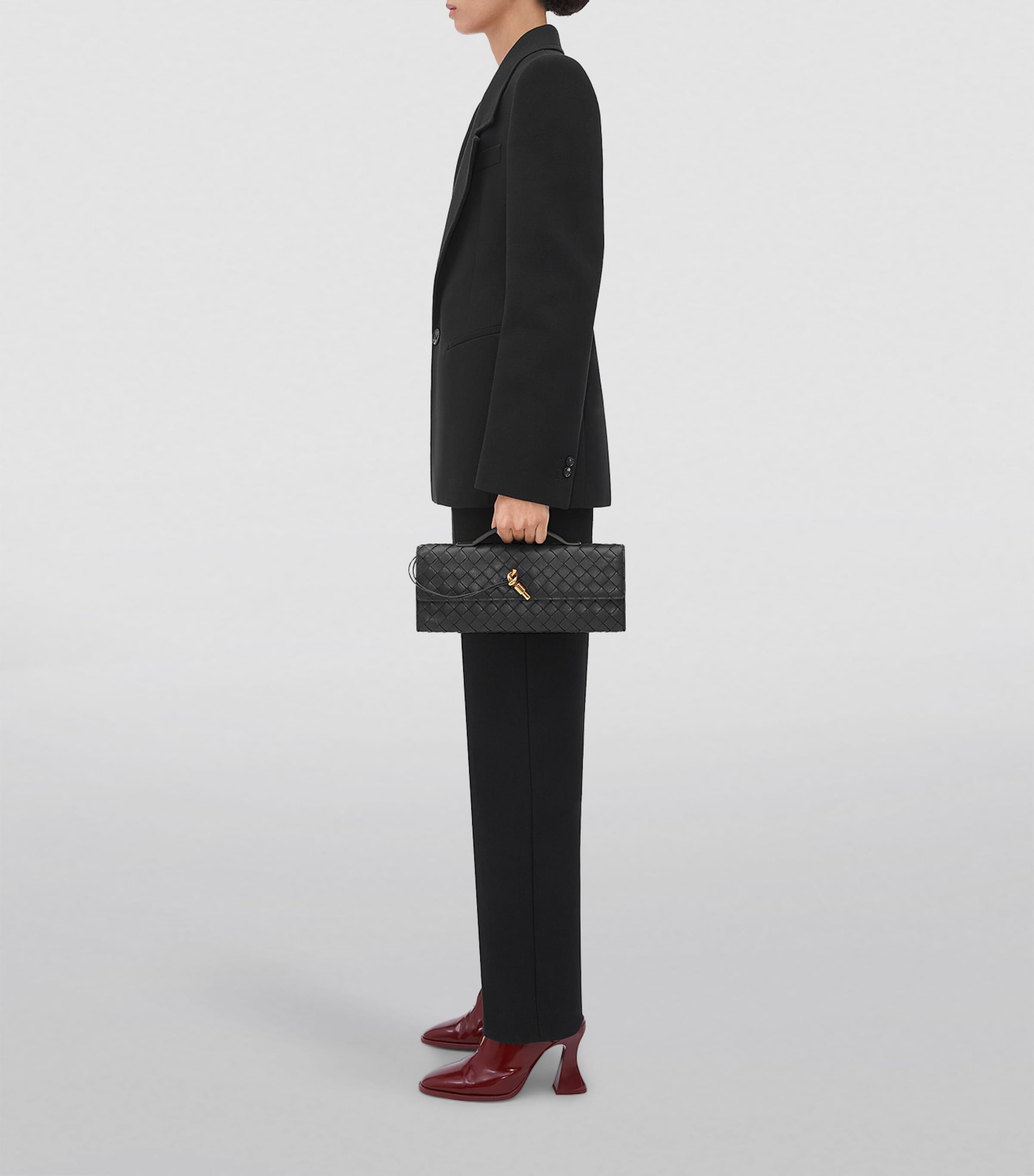 Bottega Veneta Black Leather Andiamo Clutch Bag | Harrods UK